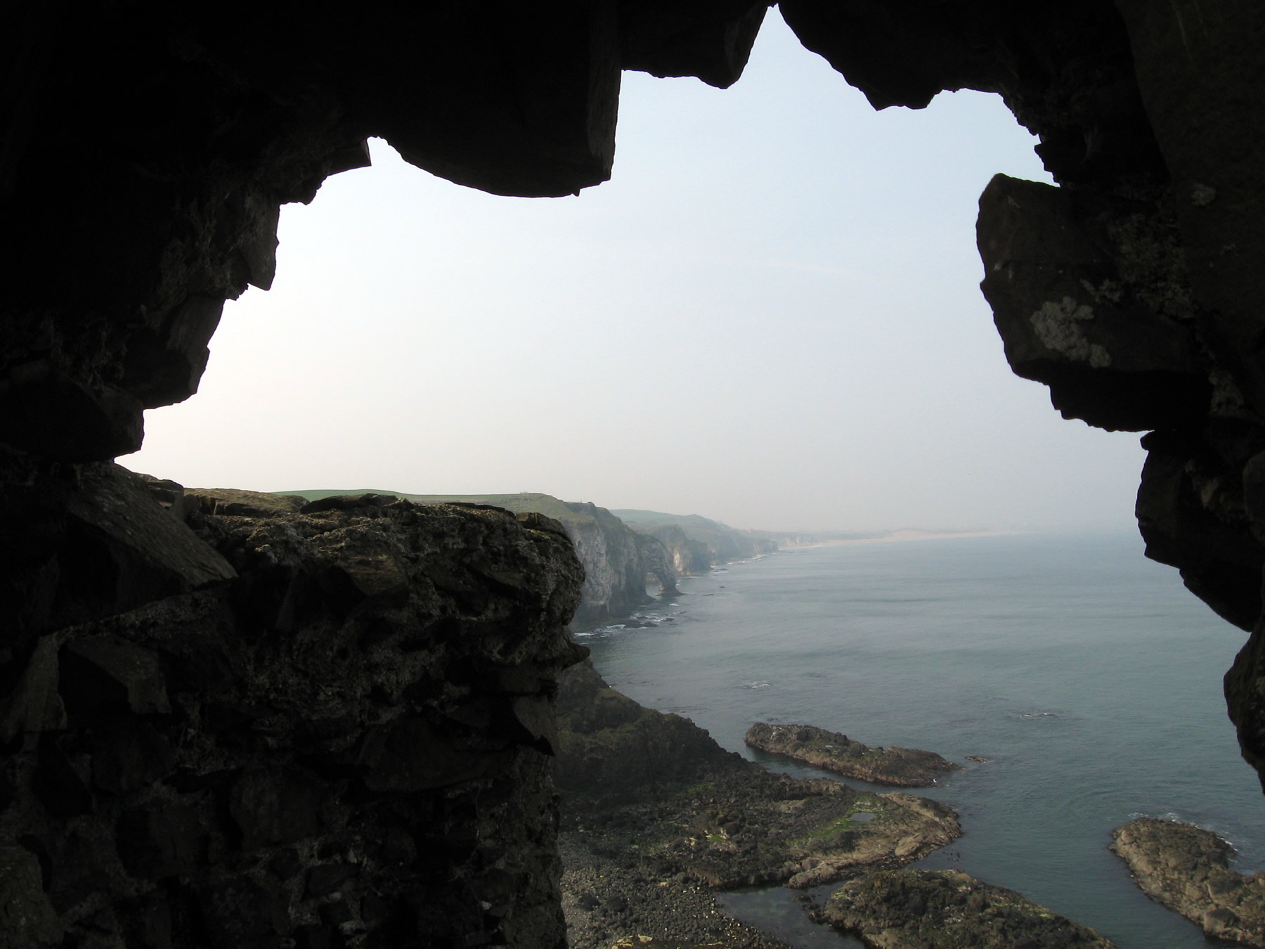 Mermaid’s Cave, a huge sea cove beneath Dunluce Castle rock – Ireland